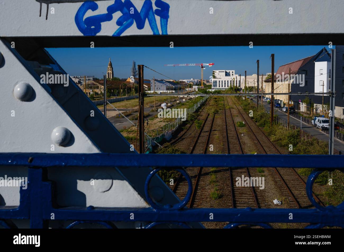 perspective horizontal view of railroad leading to modern building and ...