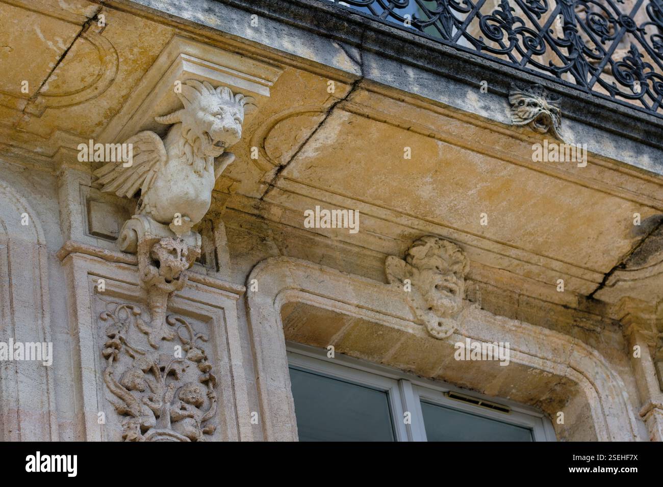 horizontal view of the under part of a balcony with a sculpture ...