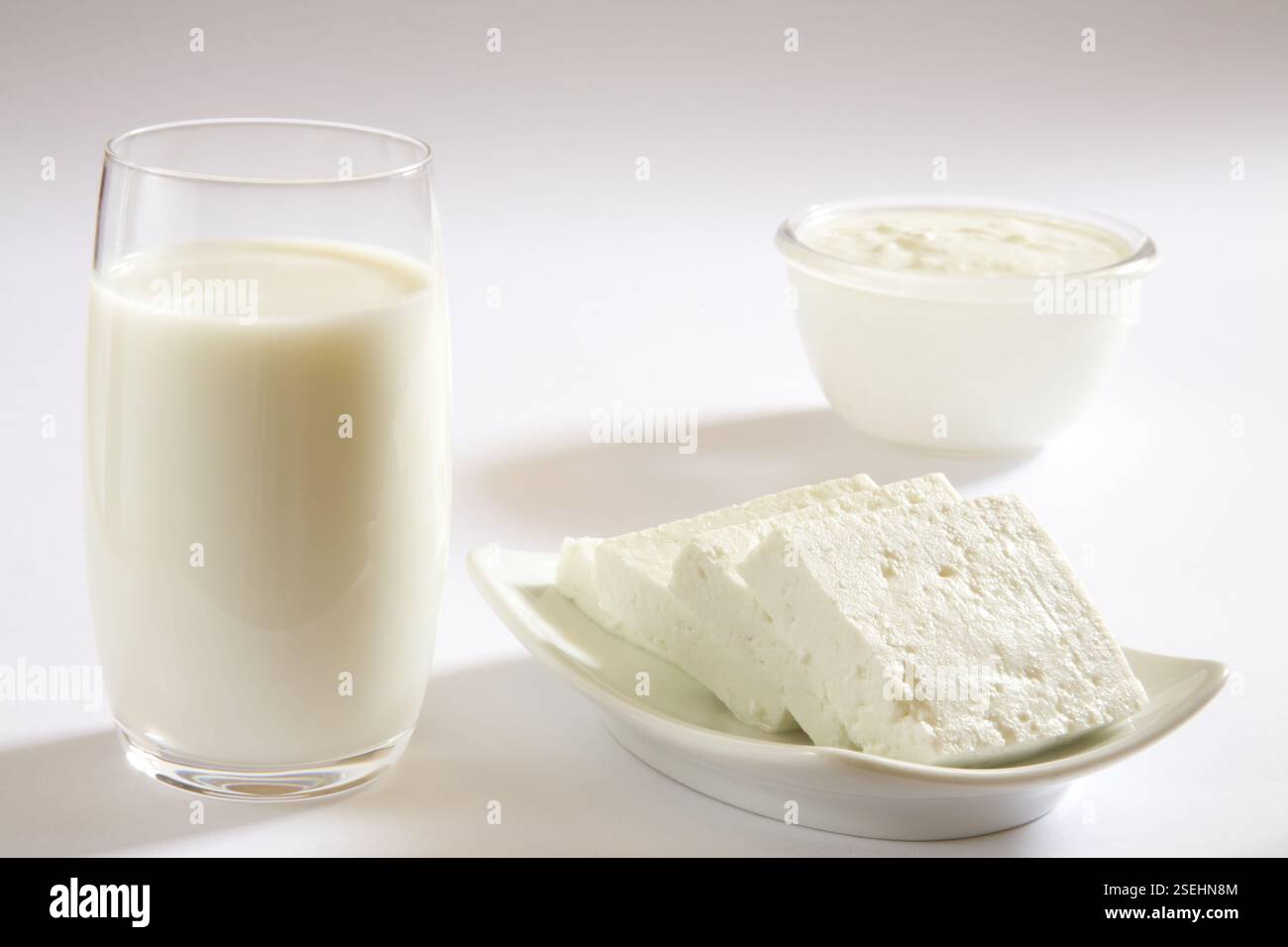 Glass of milk with curd yoghurt dahi cottage cheese paneer home or ...