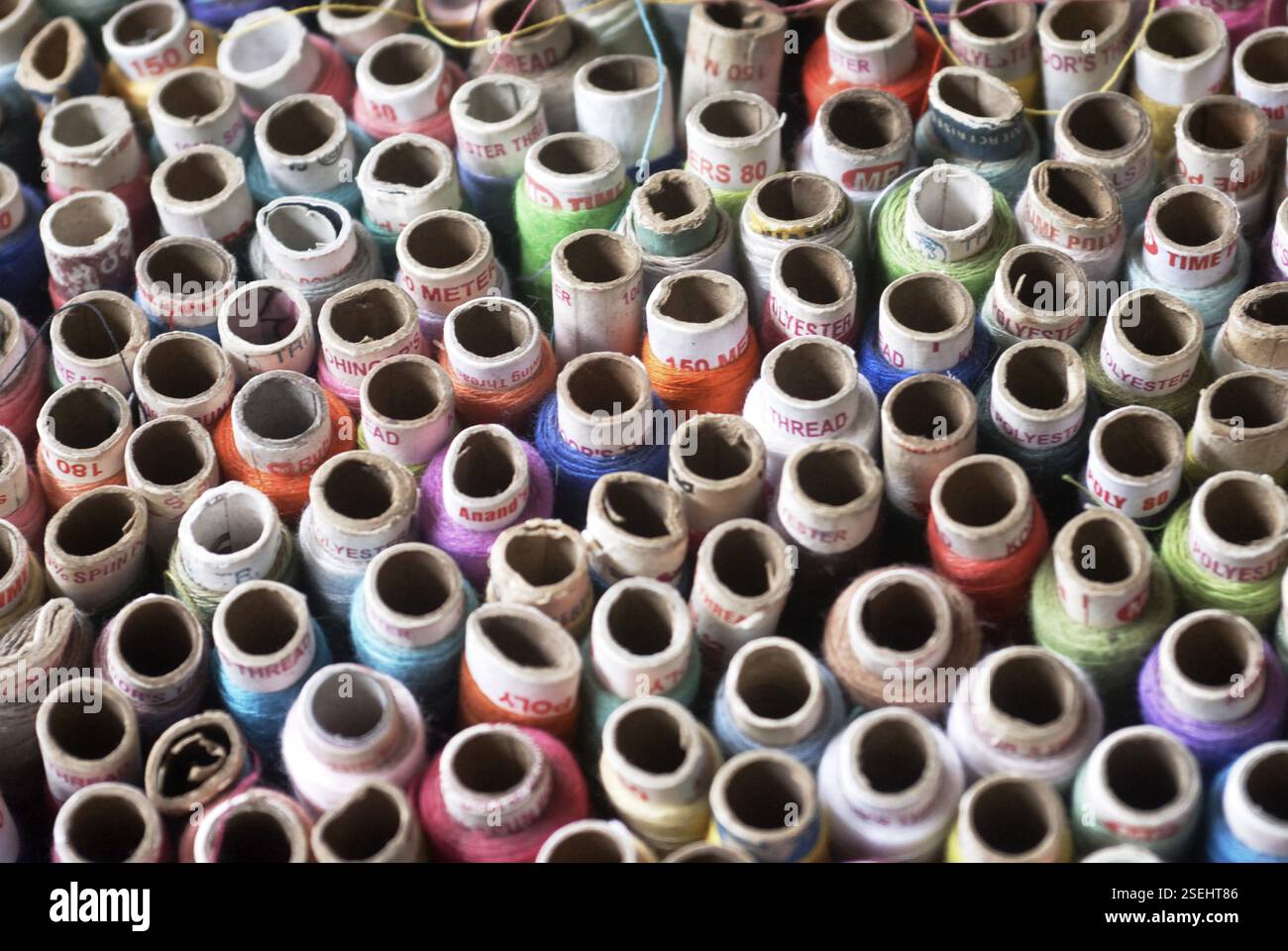 Aerial view of reels of threads of various colors tailoring material ...