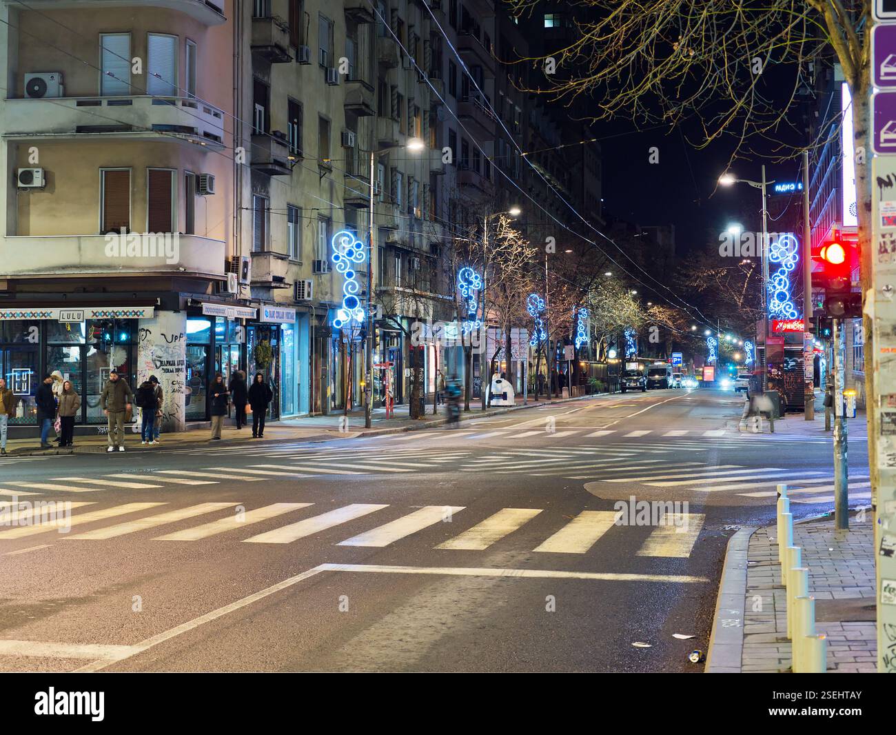 Belgrade, Serbia - January 10, 2025: Urban street at night with blue ...