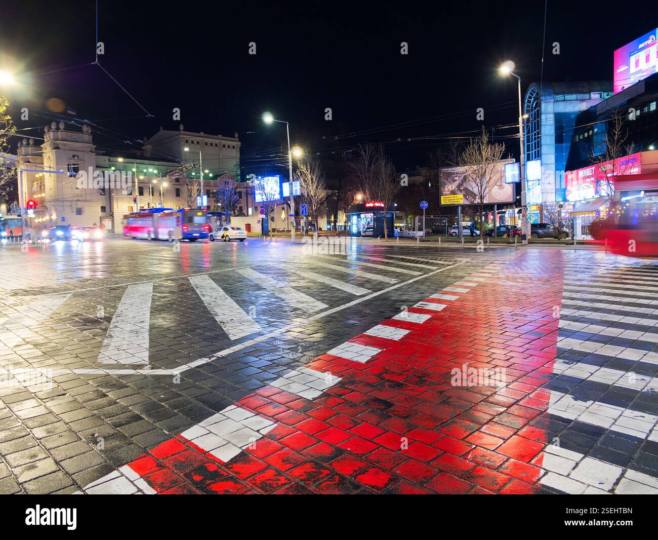 Belgrade, Serbia - January 10, 2025: Vibrant crosswalk at night with ...