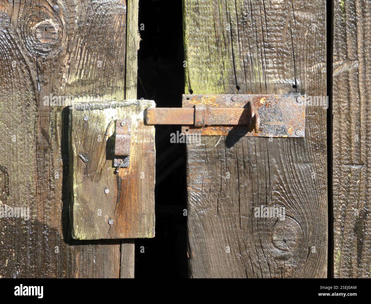 Wooden gate, door, lock, bolt Stock Photo - Alamy