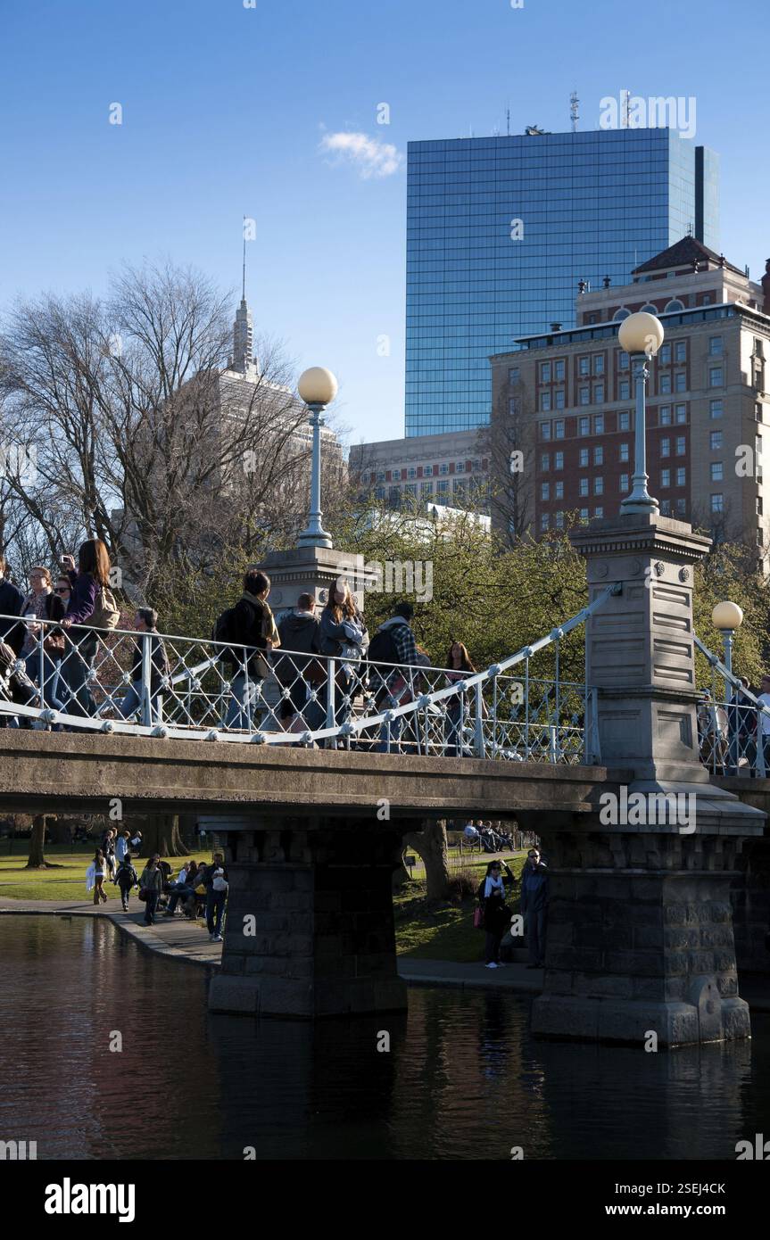 Lagoon bridge and Hancock Tower behind in Public Garden of Boston ...