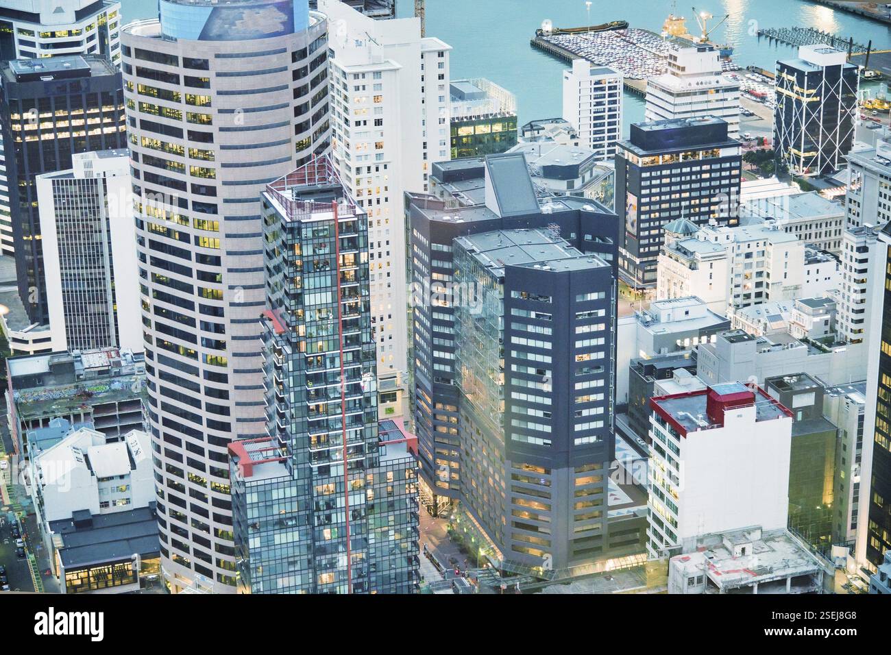 Amazing aerial view of Auckland skyline at sunset. City buildings and ...