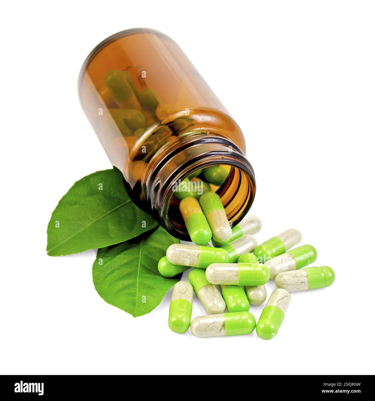 Green capsules in an open brown glass and on the table, two green ...