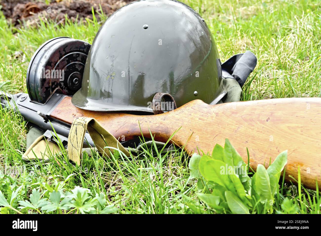 A helmet and a submachine gun of the times of the Great Patriotic War ...