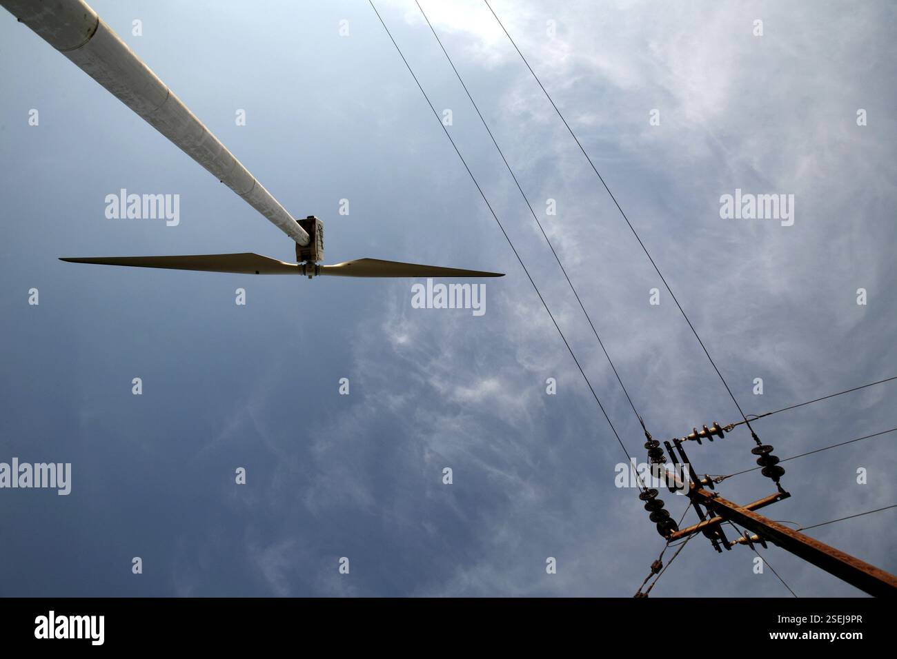 Windmill at electric lines pole at Sankeshwar in Karnataka, India, Asia ...