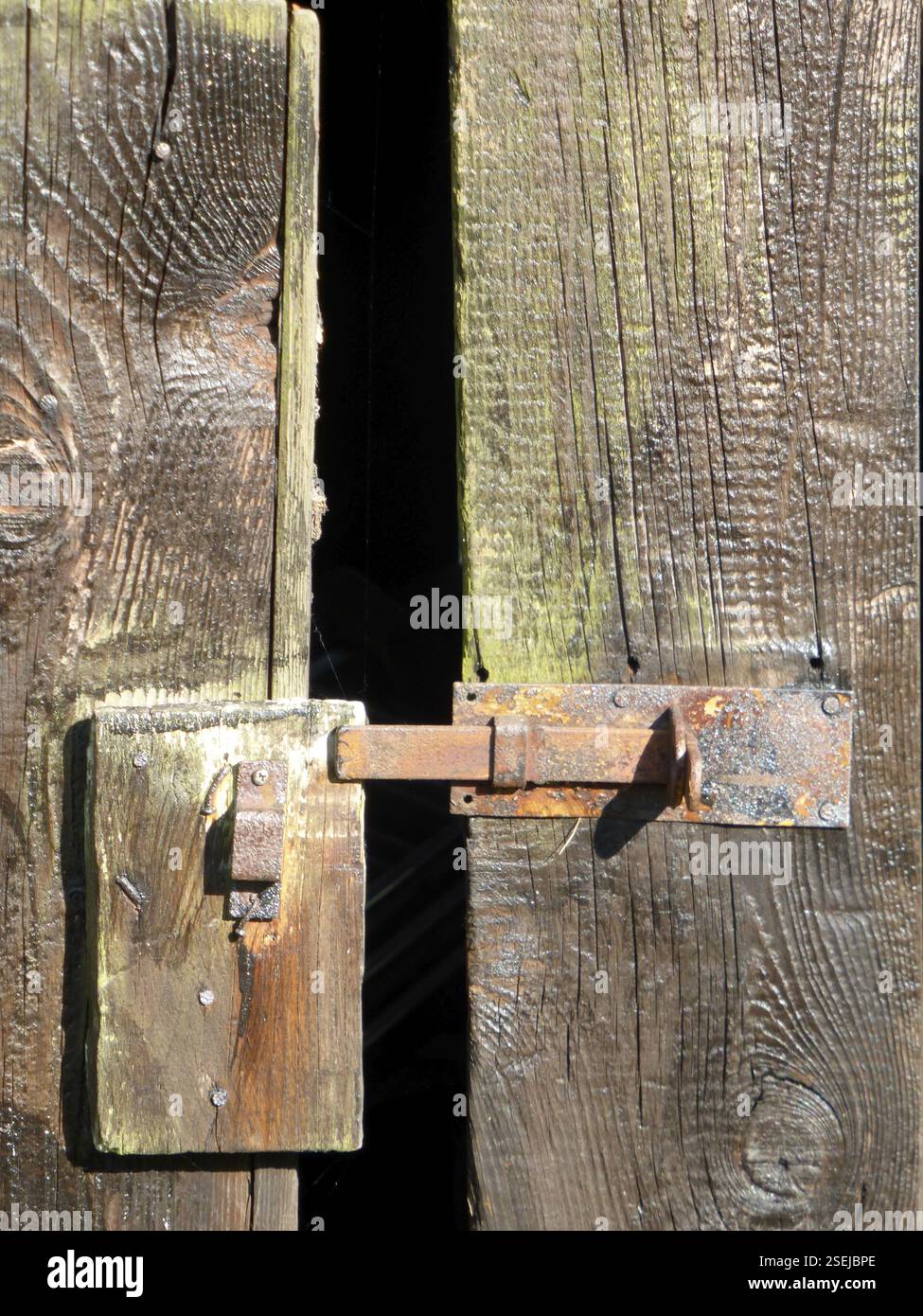 Wooden gate, door, lock, bolt Stock Photo - Alamy