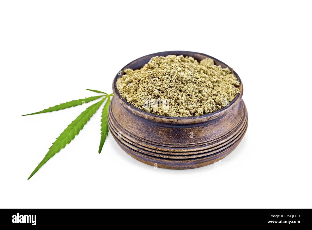 Hemp flour in a bowl, cannabis green leaf isolated on white background ...