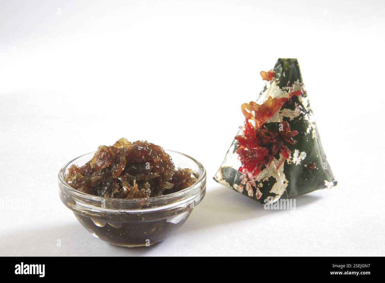 Gulkand and gilouri pan folded in betel leaves on white background ...