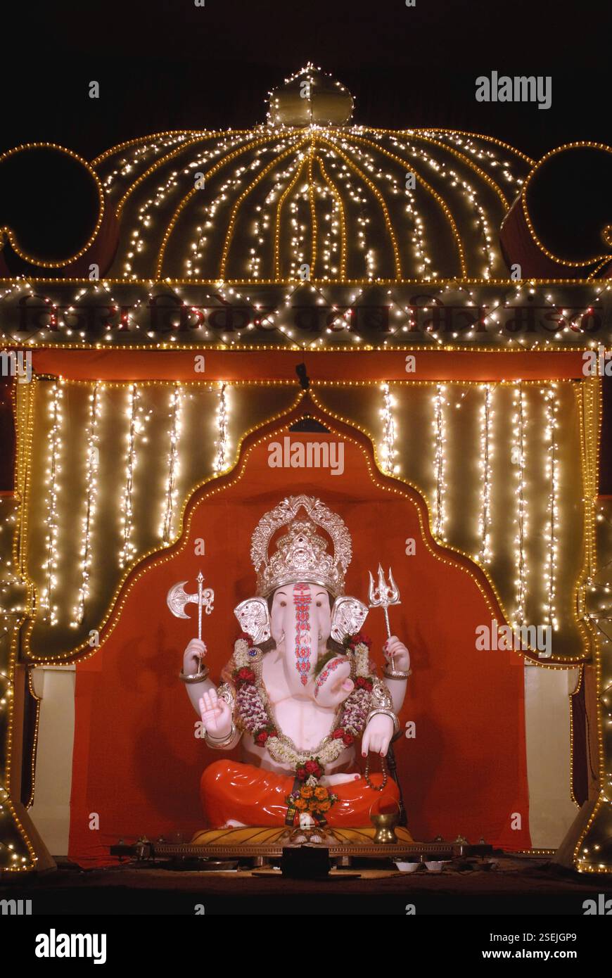 Idol of lord Ganesh elephant headed god kept in gaily decorated frame ...