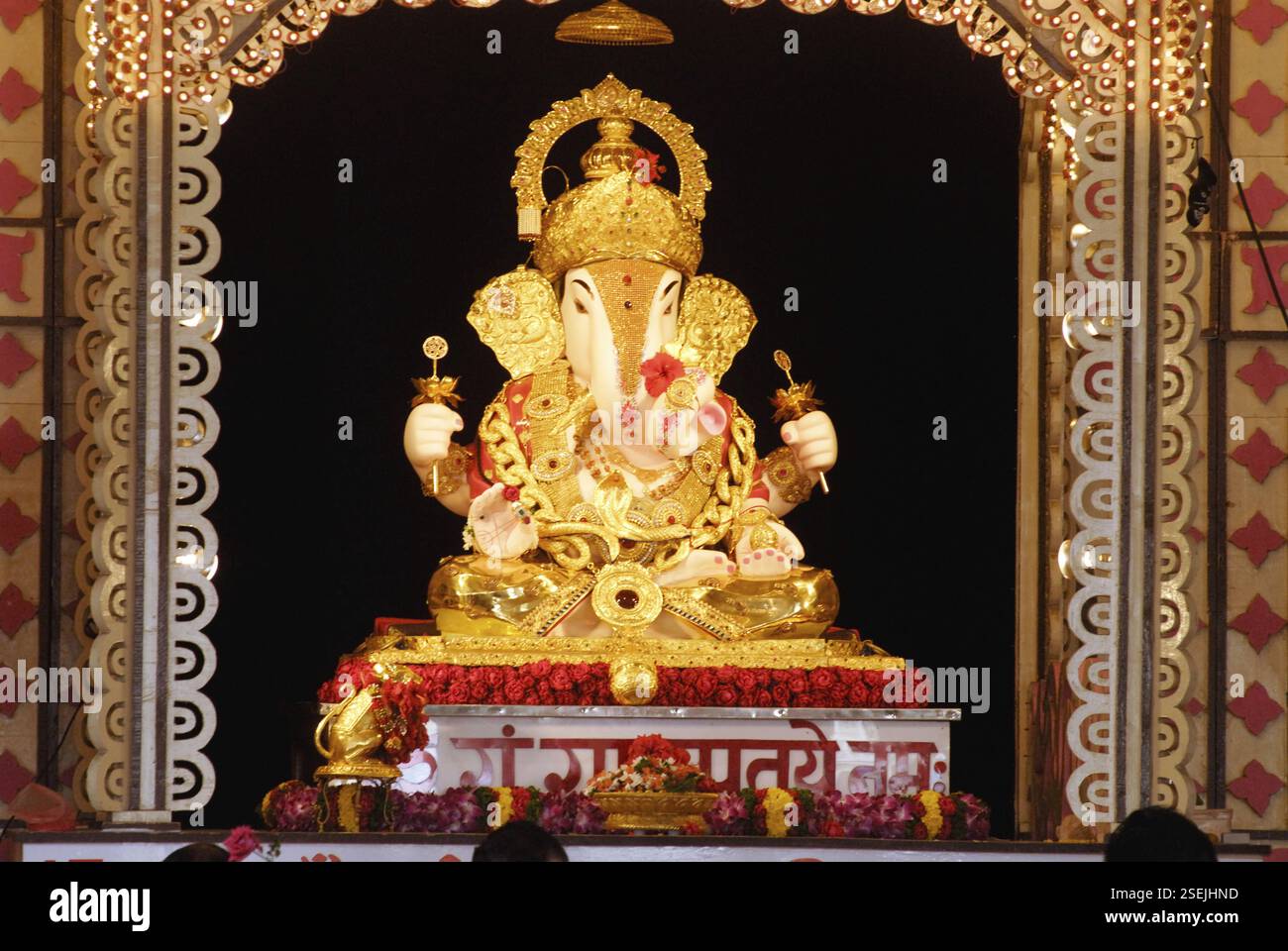 Idol of lord ganesh elephant headed god with richly illuminated ...