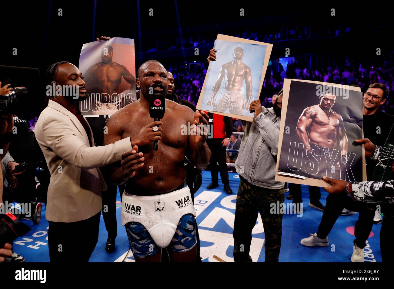 Derek Chisora with images of Oleksandr Usyk, Anthony Joshua and Daniel ...