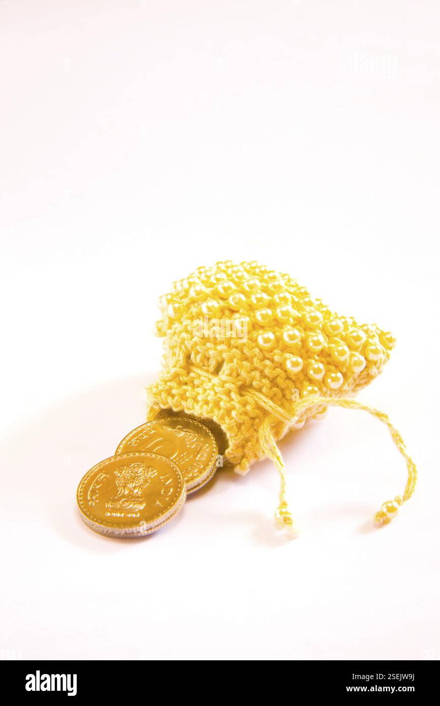 Concept, growth Indian currency coin five rupees and batua Stock Photo ...