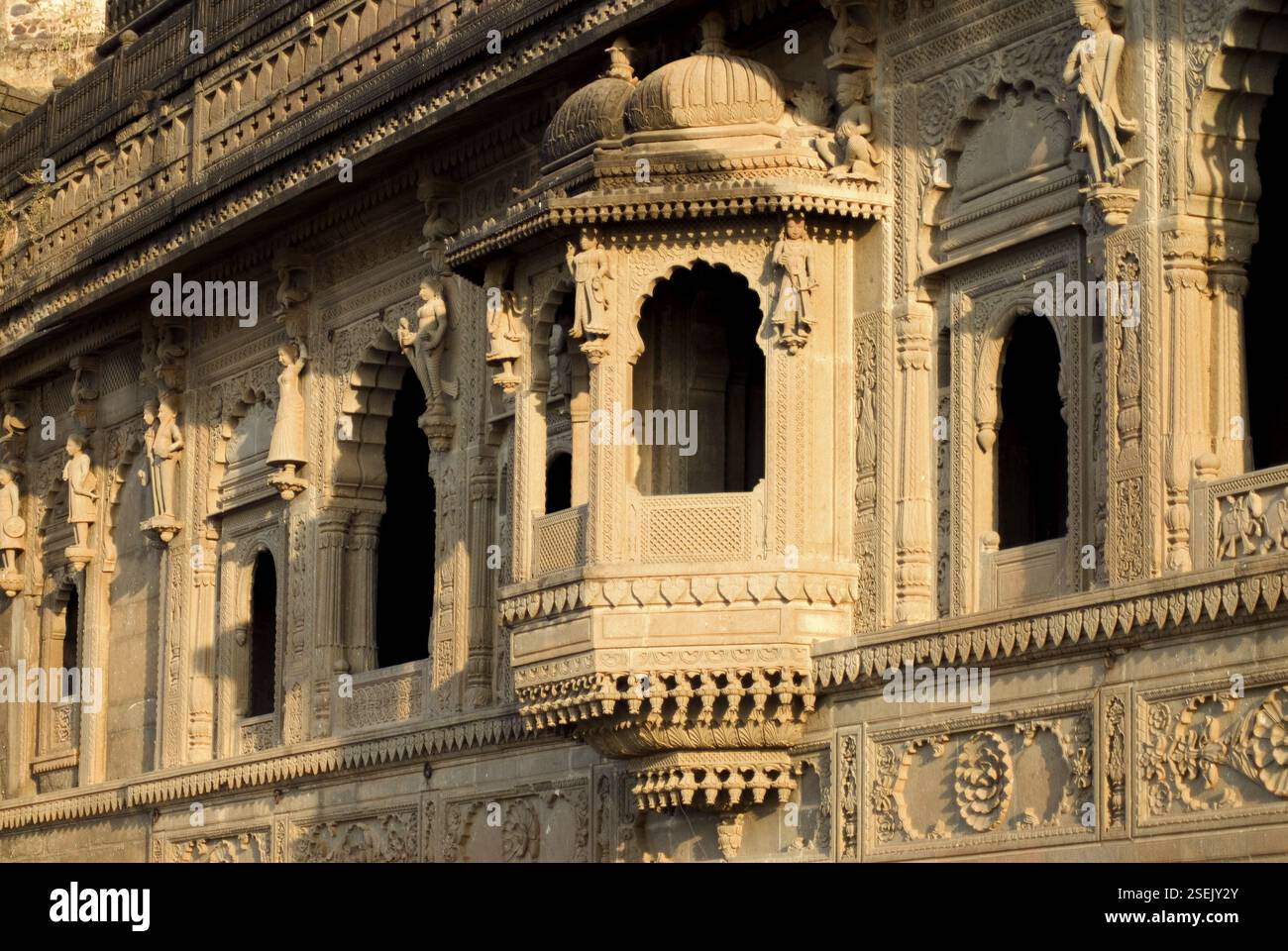 Carved overhanging balconies at Maheshwar temple, Maheshwar, Madhya ...