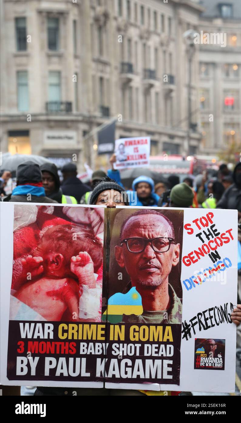 London, England, UK. 8th Feb, 2025. Protesters march behind a sign ...