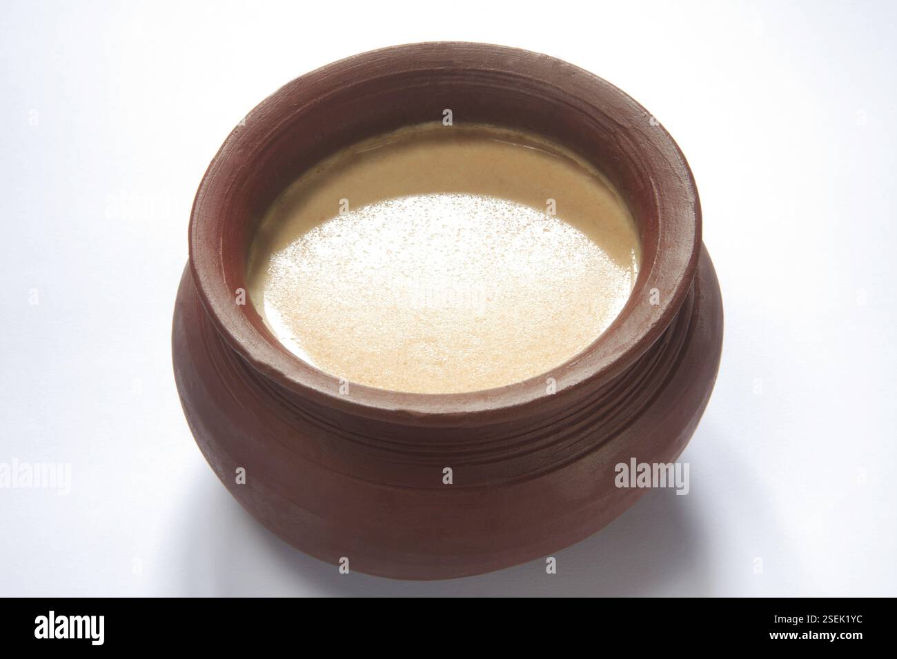 Indian sweet, mishti doi bengali mithai in earthen pot on white ...