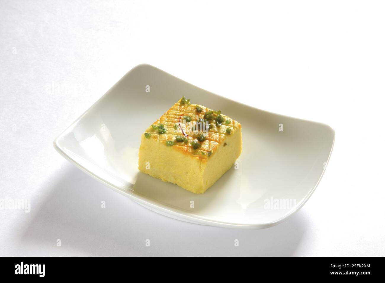 Indian sweet, sandesh bengali mithai garnish with pistachio and saffron ...