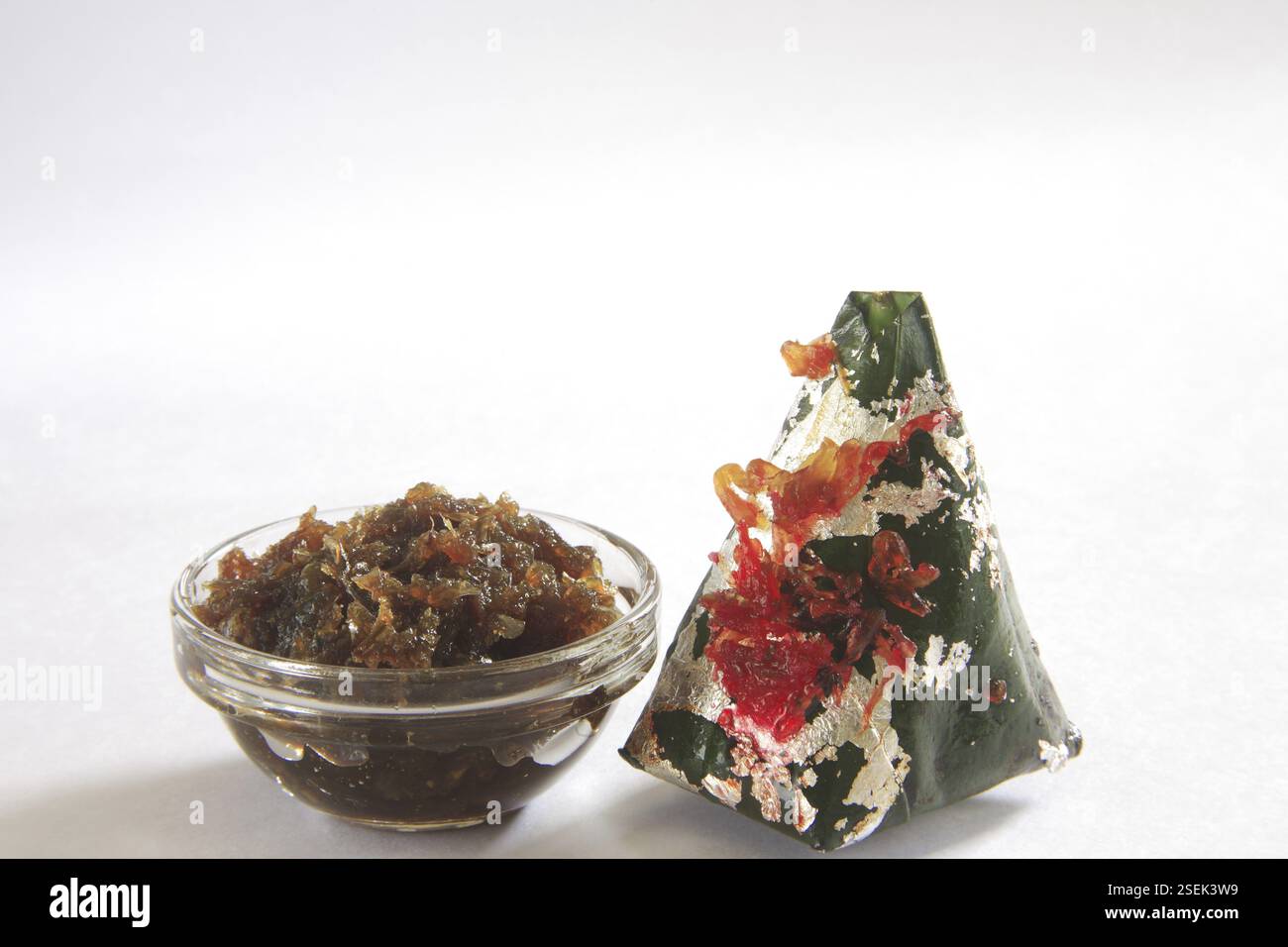 Gulkand and gilouri pan folded in betel leaves on white background ...
