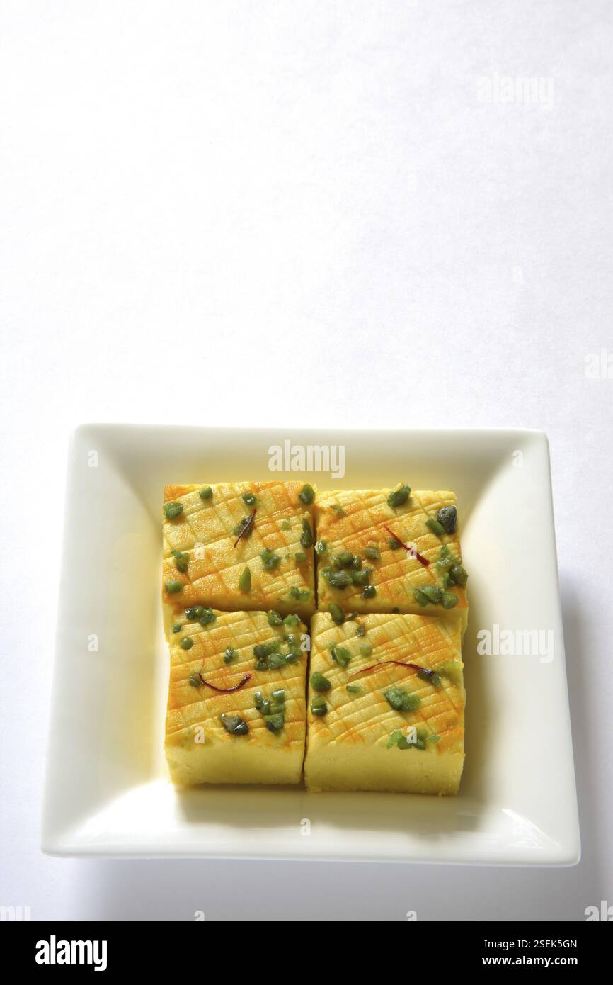 Indian sweet, sandesh bengali mithai garnish with pistachio and saffron ...