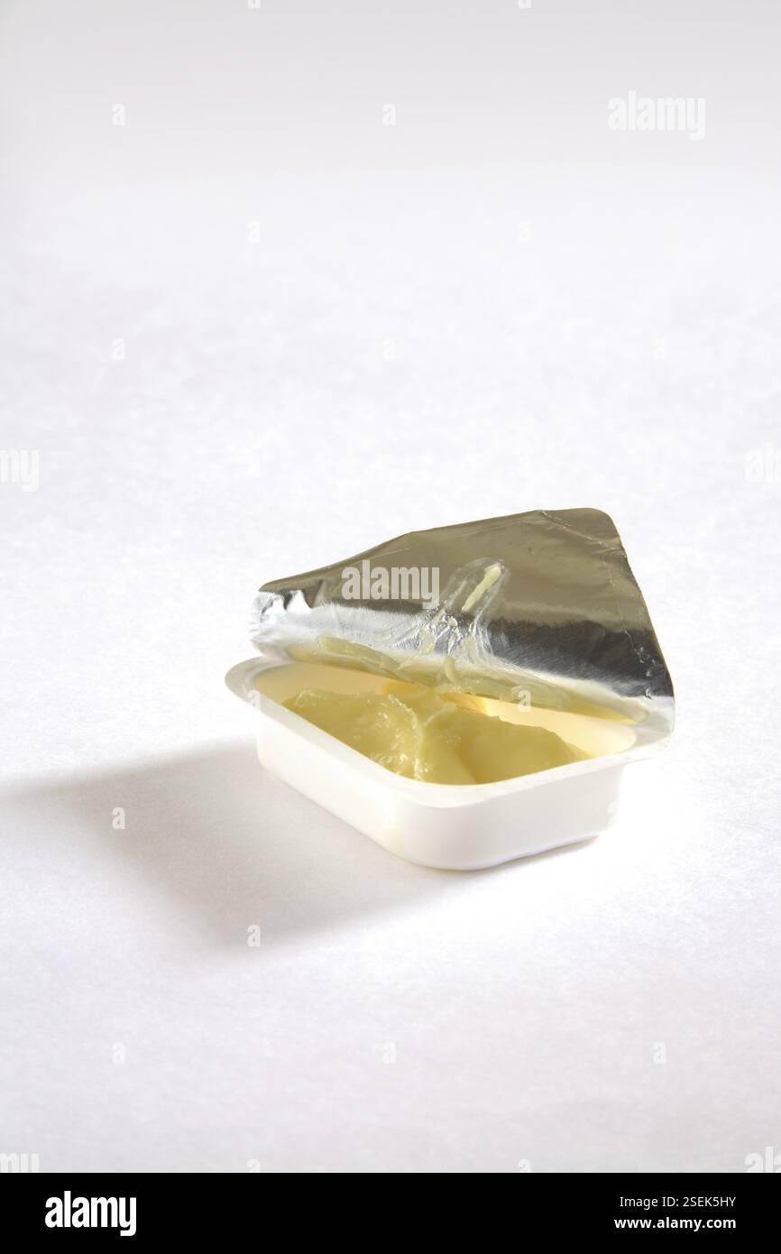 Dairy product, makhan maska butter in half open container on white ...