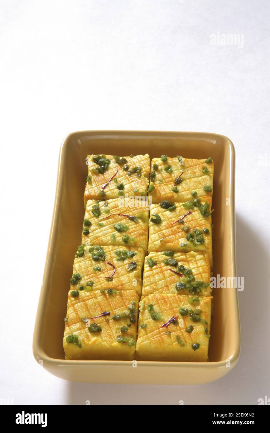 Indian sweet, sandesh bengali mithai garnish with pistachio and saffron ...