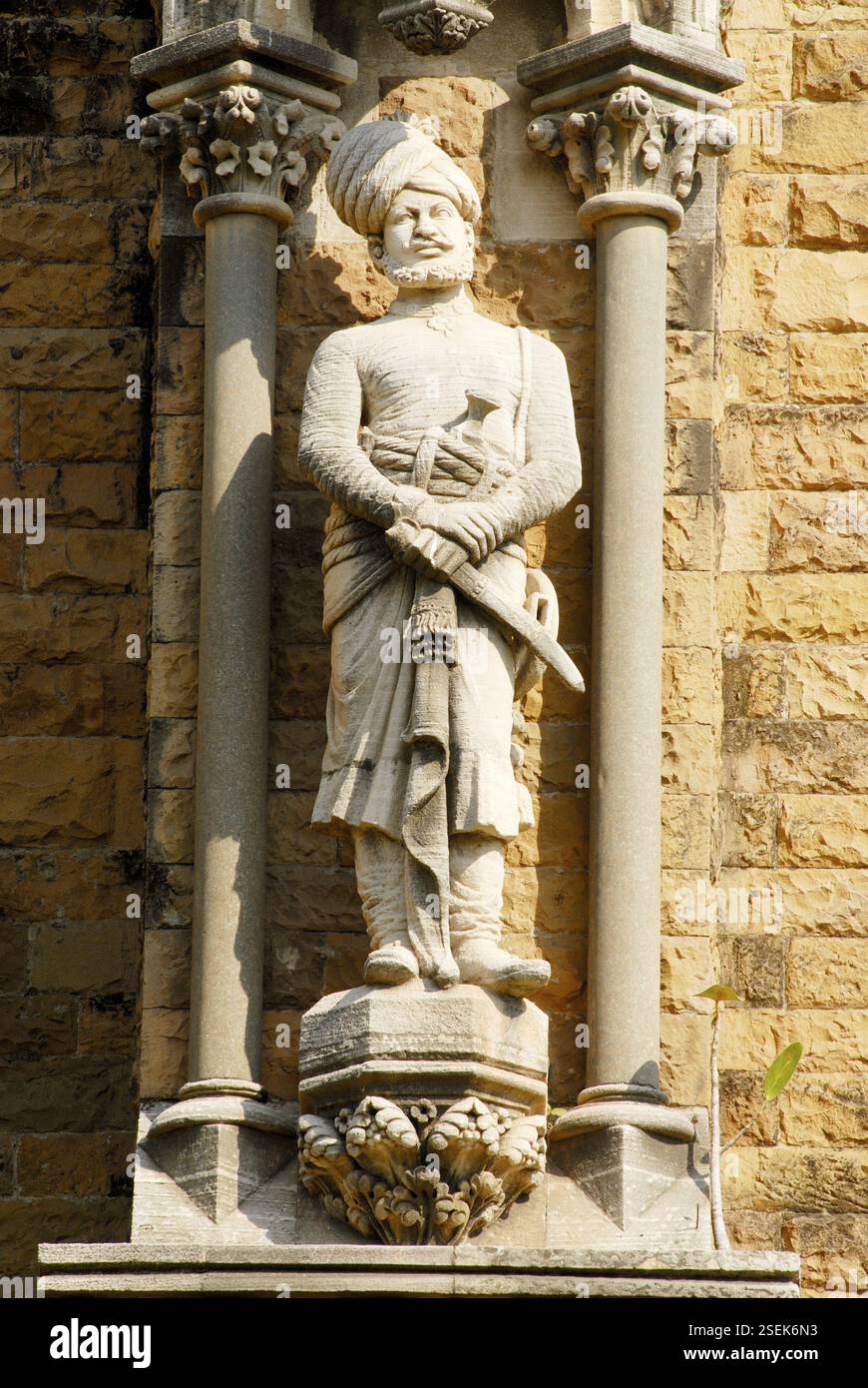 Richly carved human figure local man on Rajabai tower clock tower ...