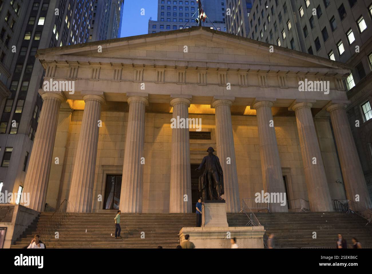 Federal hall and George Washington statue on Wall Street, New York, USA ...