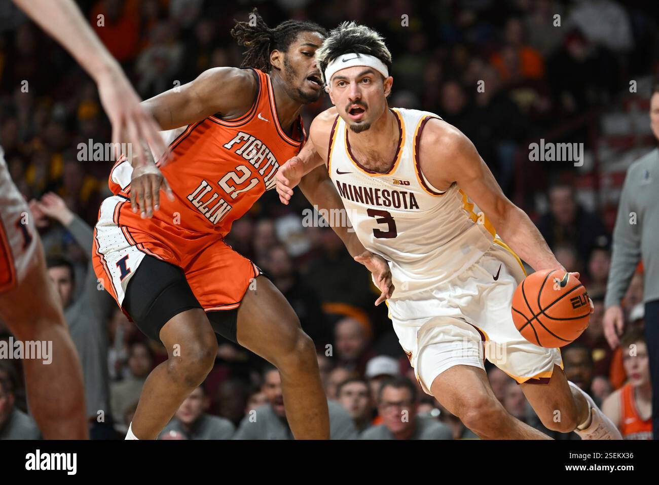 Minnesota forward Dawson Garcia (3) drives past Illinois forward Morez ...