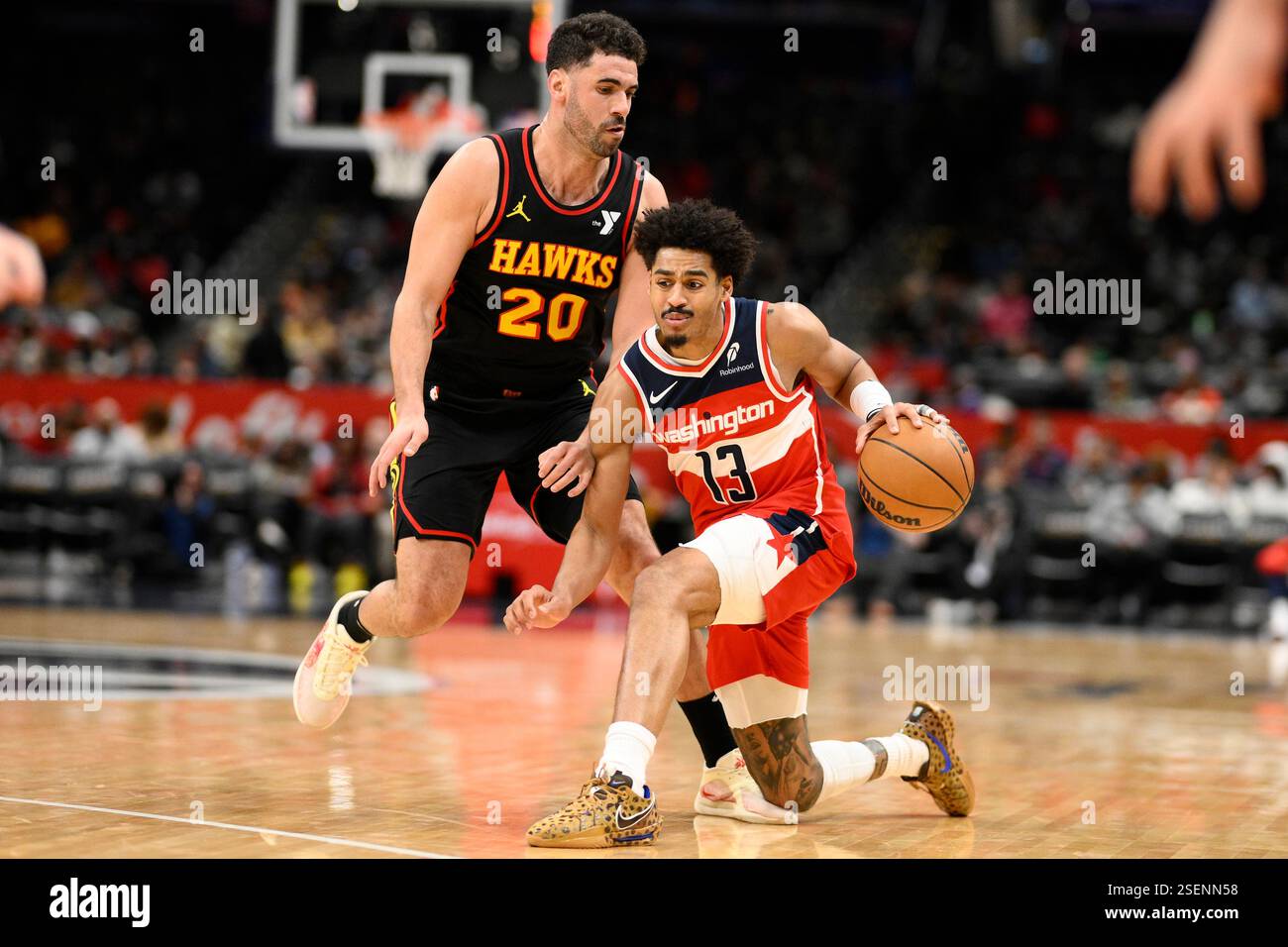 Washington Wizards guard Jordan Poole (13) dribbles against Atlanta Hawks forward Georges Niang ...