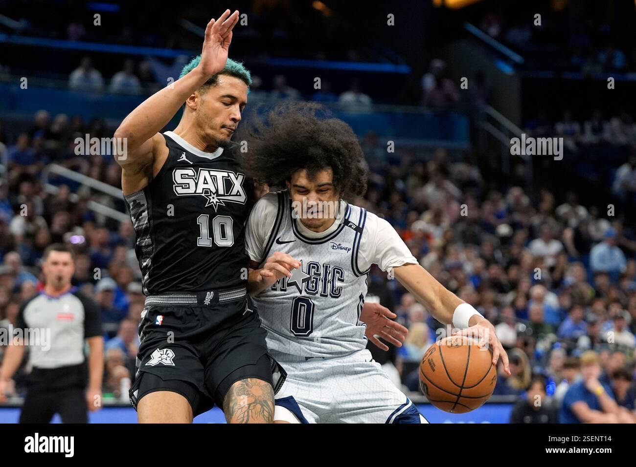 San Antonio Spurs forward Jeremy Sochan (10) fouls Orlando Magic guard ...