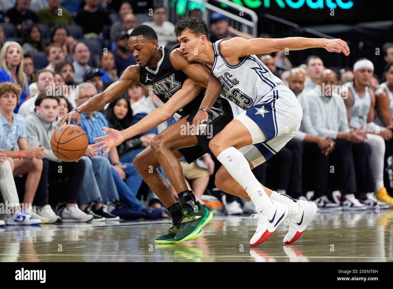 San Antonio Spurs guard De'Aaron Fox, left, and Orlando Magic forward ...