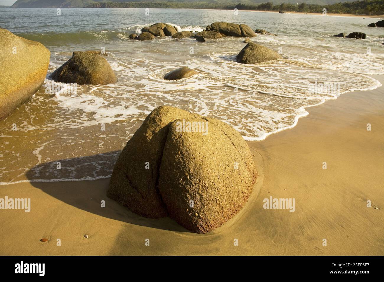Stones in water waves on Agonda beach, Goa, India, Asia Stock Photo - Alamy