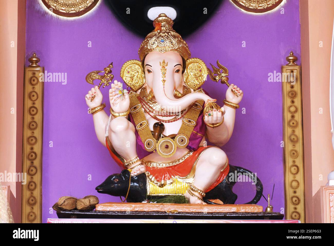Richly decorated idol of lord Ganesh elephant headed god sitting on ...
