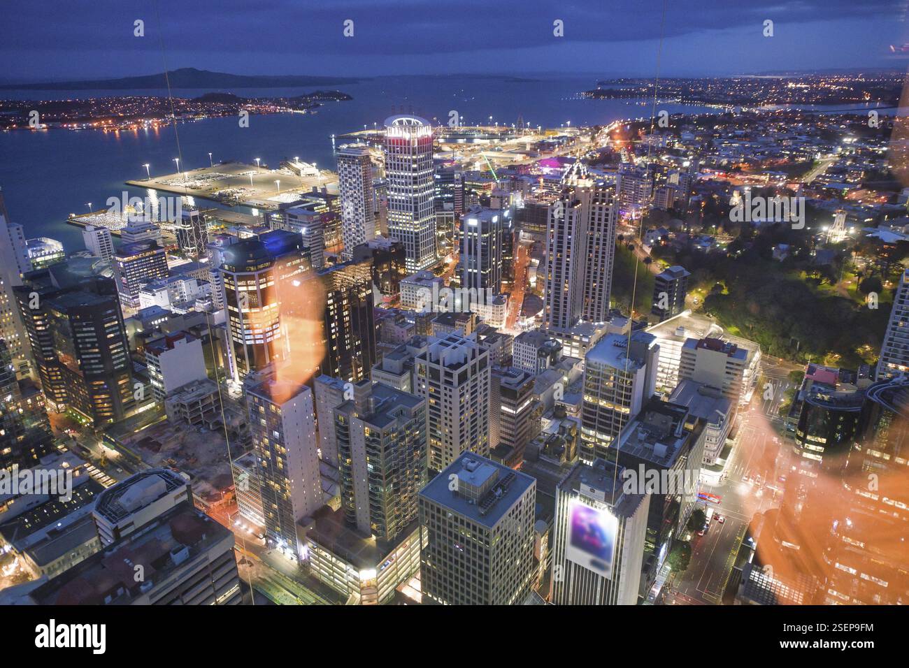 Amazing aerial view of Auckland skyline at night. City buildings and ...