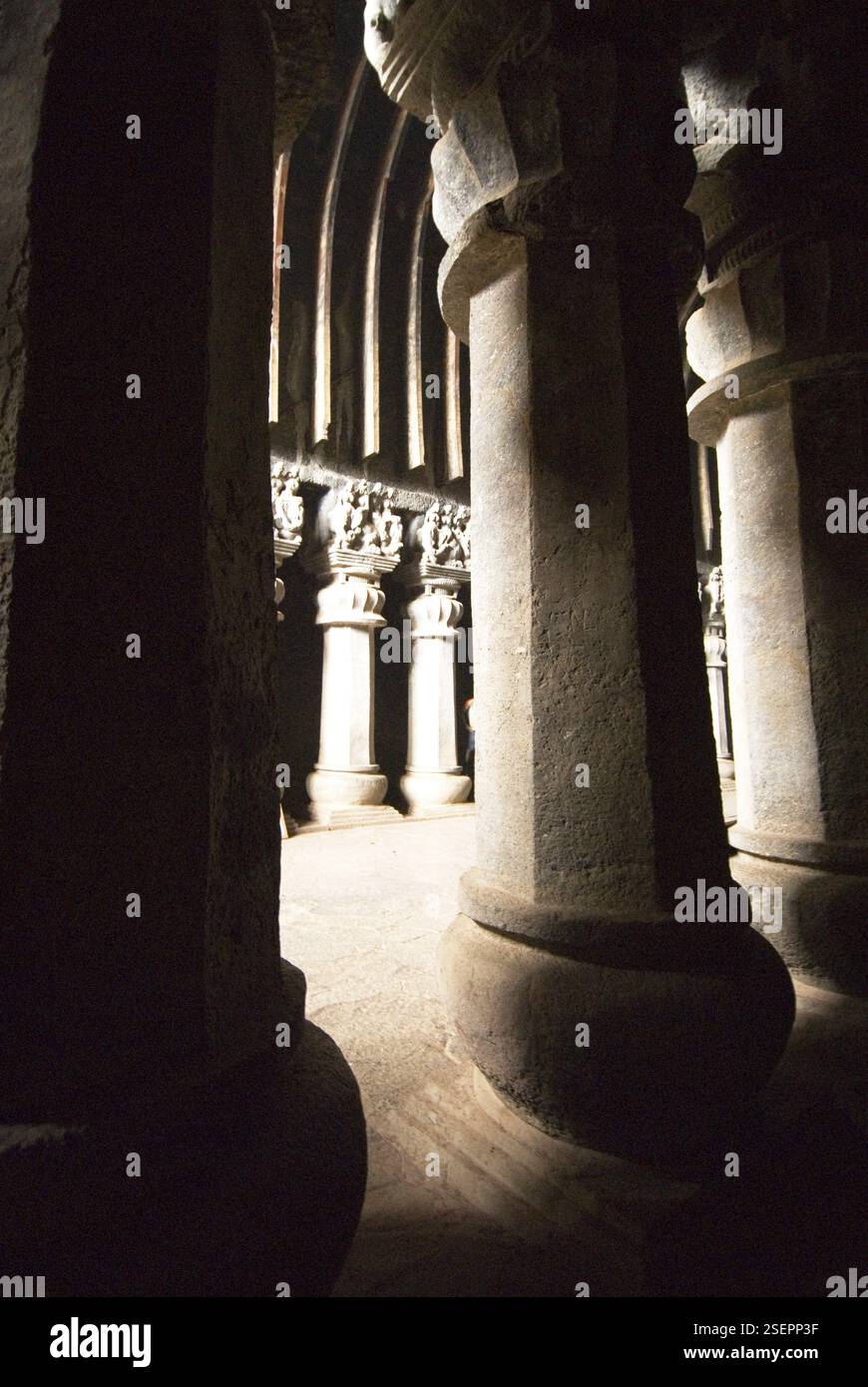 Decorative pillars of Karla rock cut cave near hills of Lonavala ...