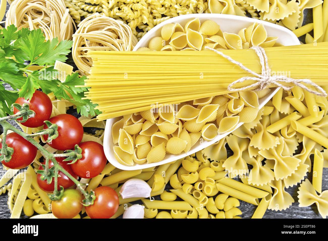 Pasta seashells and spaghetti in bowl, pipe rigate, tagliatelle ...