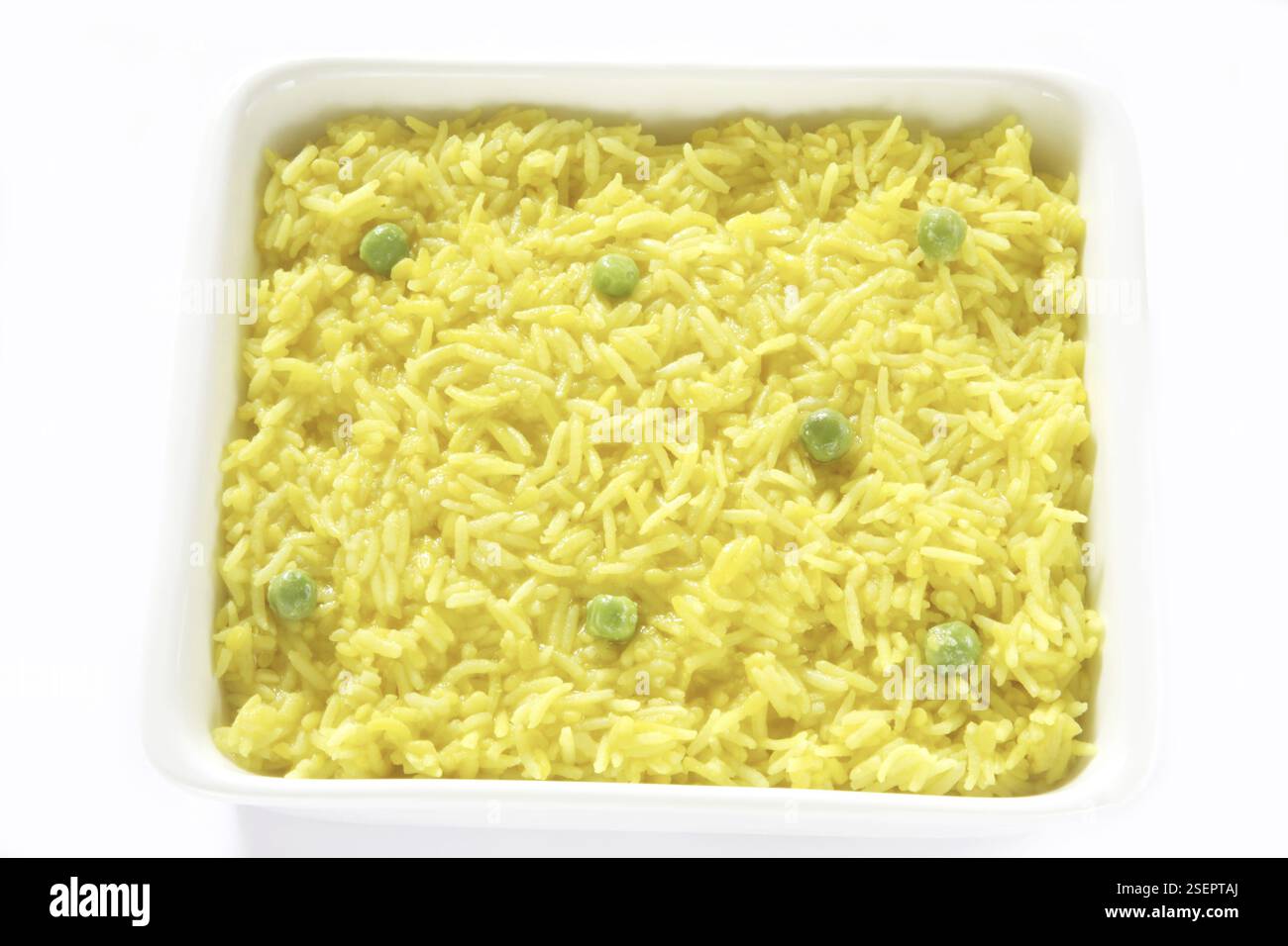 Indian cuisine khichdi garnish green peas served in deep plate on white ...