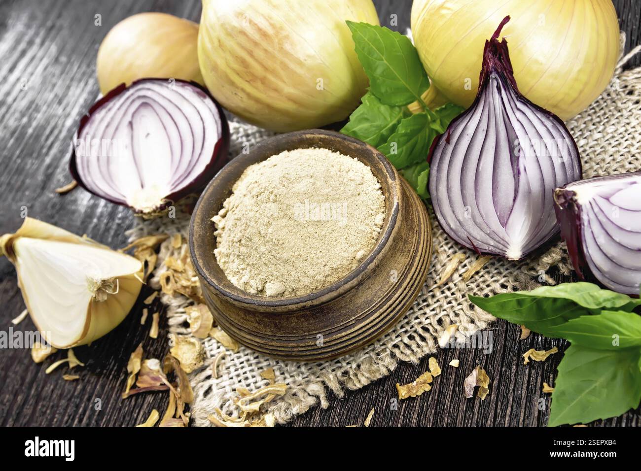 Onion powder in a bowl on sacking, purple and yellow onions, dried ...