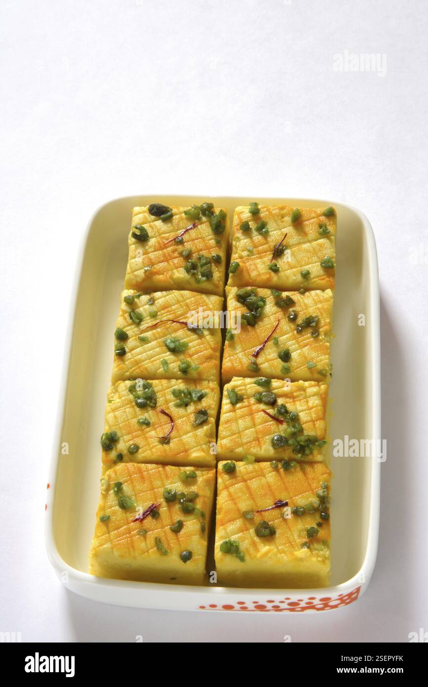 Indian sweet, sandesh bengali mithai garnish with pistachio and saffron ...