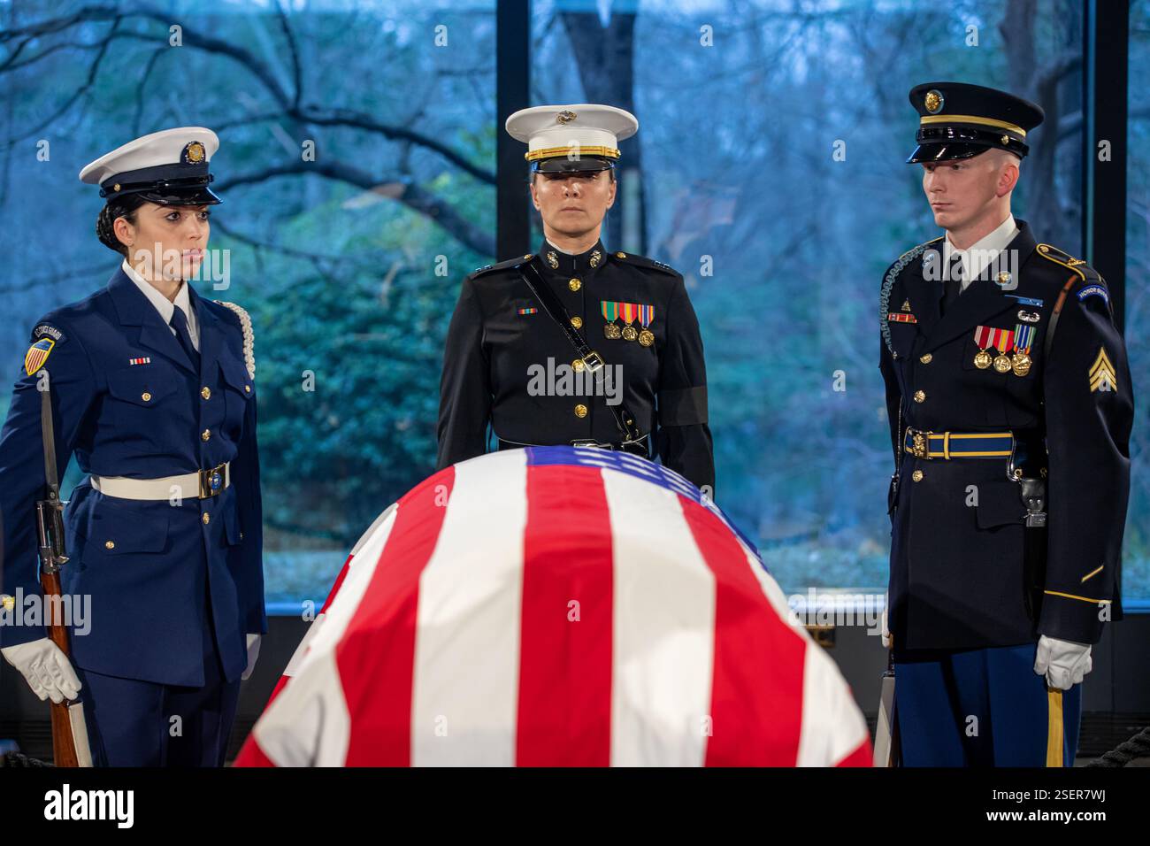 U.S. service members from the Ceremonial Honor Guard stand ready to ...
