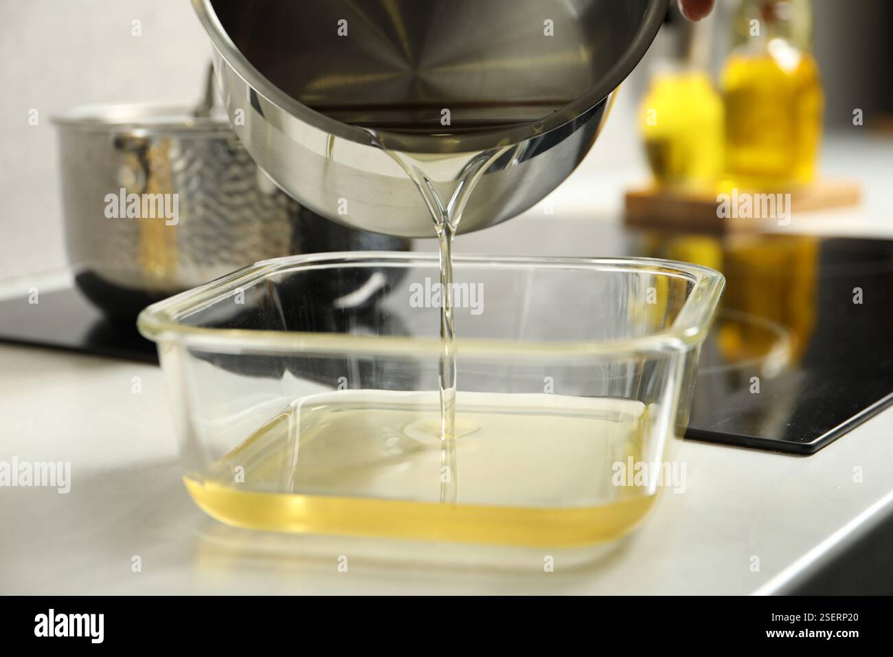 Pouring used cooking oil hi-res stock photography and images - Alamy