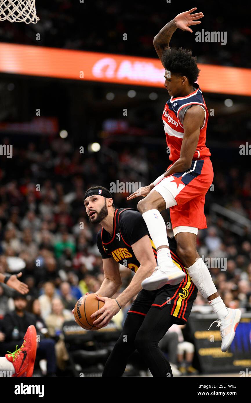 Atlanta Hawks forward Larry Nance Jr., bottom, gets fouled by ...