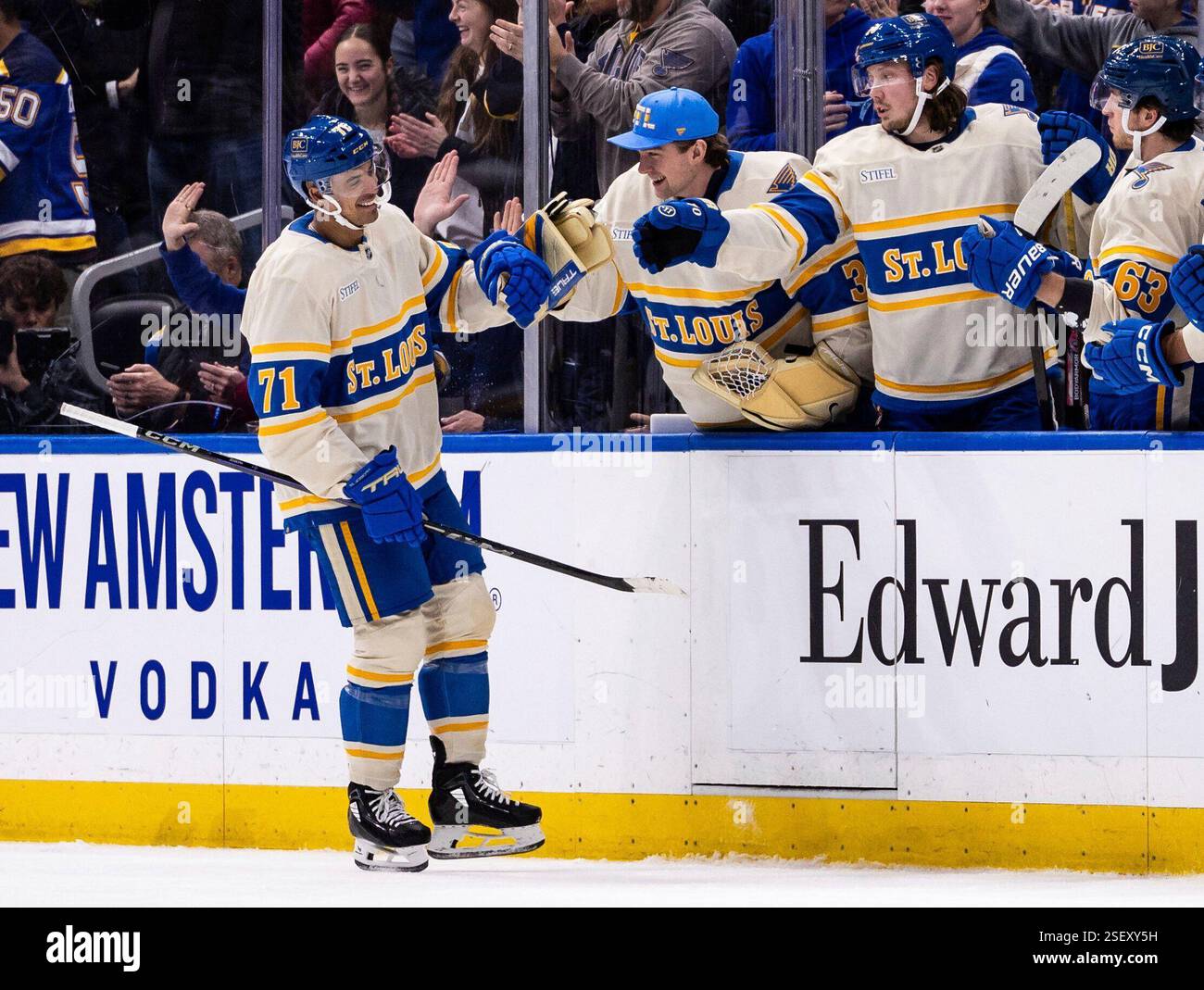 St. Louis Blues forward Mathieu Joseph skates up to the bench after ...