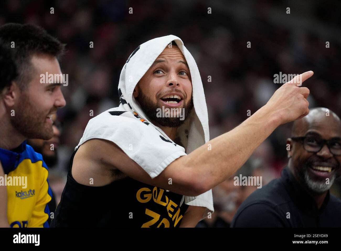 Golden State Warriors guard Stephen Curry, center, reacts on the bench ...