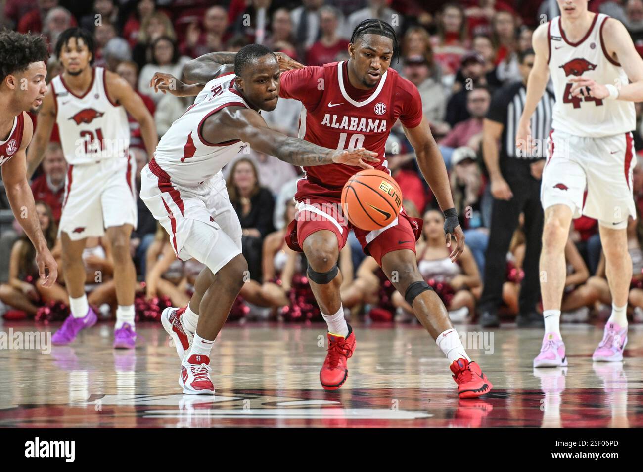 Arkansas guard Johnell Davis, center left, and Alabama forward Mouhamed ...