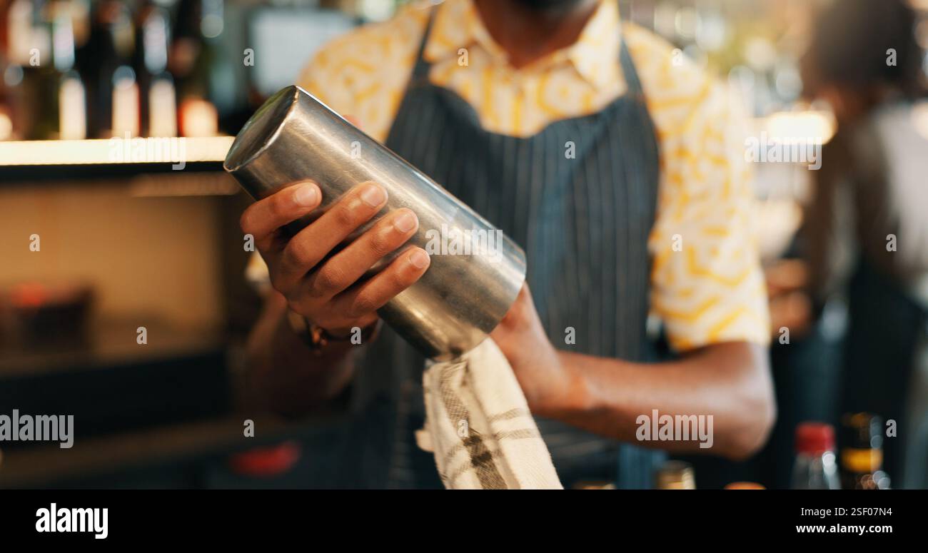 Bartender, hands and man with cup, wiping and cleaning with routine ...