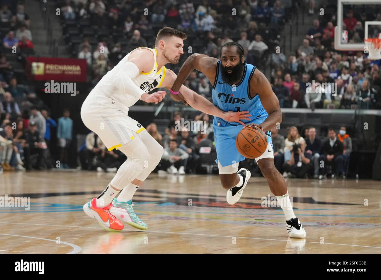 Los Angeles Clippers' James Harden, right, is pressured by Utah Jazz's ...