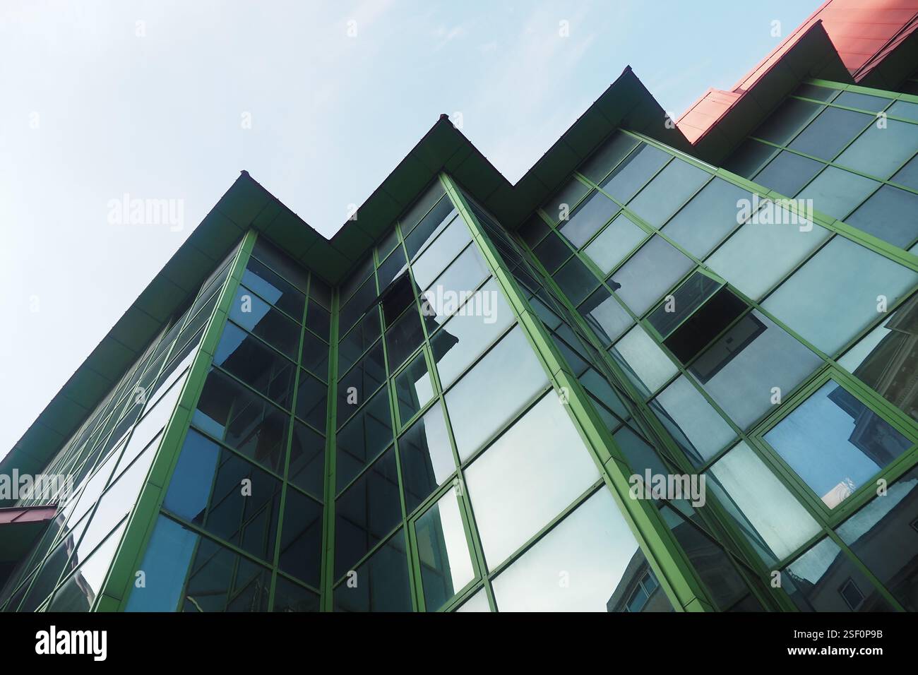 Modern architecture with green accents and glass panels Stock Photo - Alamy